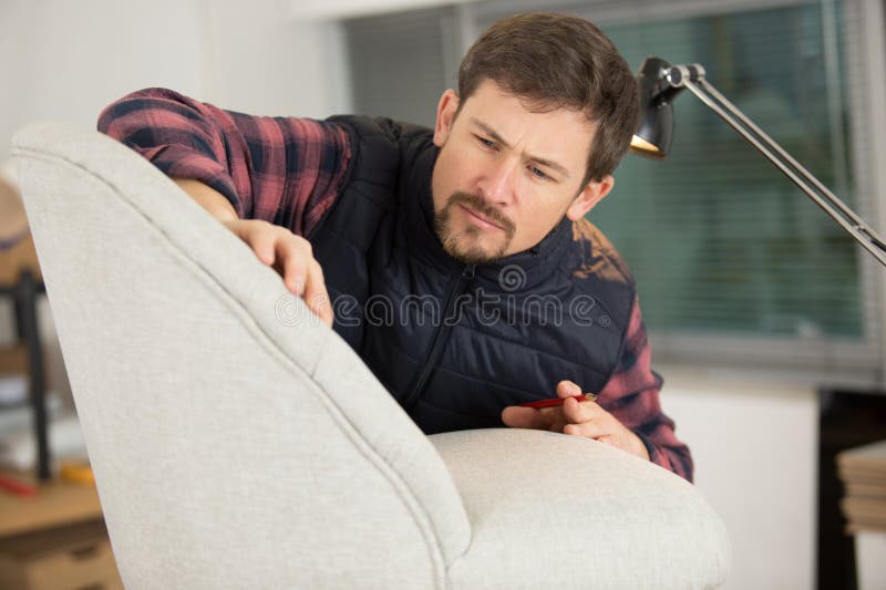 Young man moving sofa stock image. Image of sofa, moving - 309077087