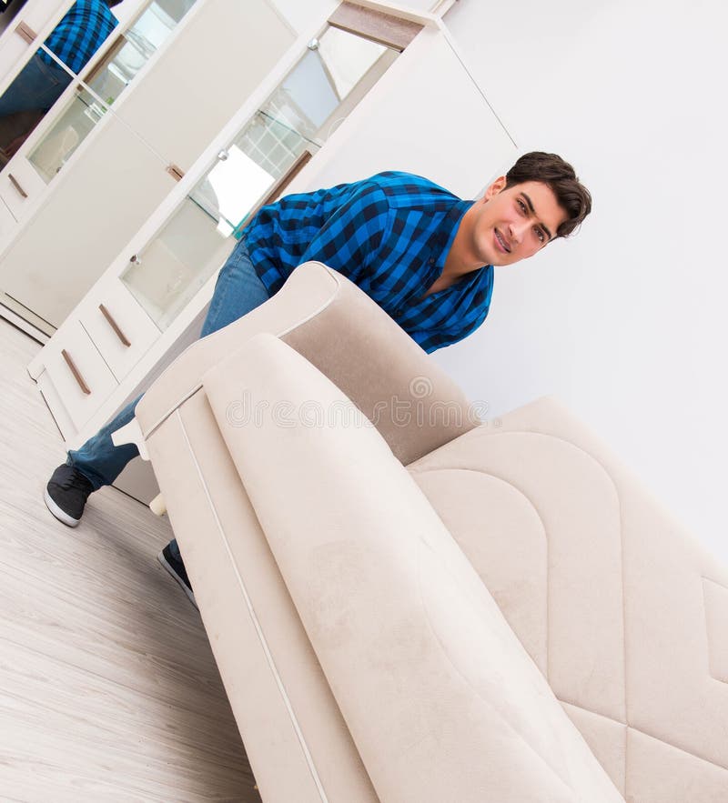 Young Man Moving Sofa Couch Stock Image - Image of furniture, apartment ...