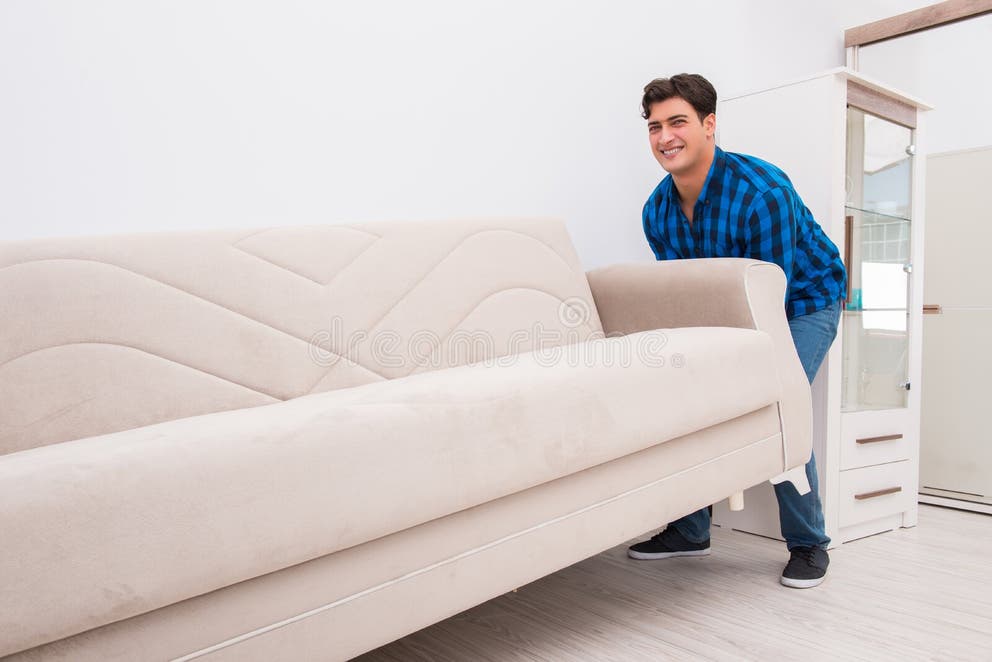 The Young Man Moving Sofa Couch Stock Photo - Image of casual, pain ...
