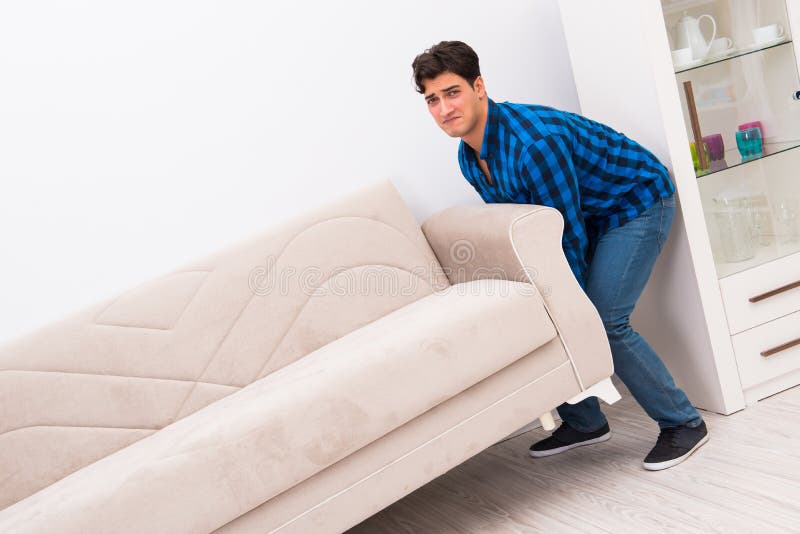 The Young Man Moving Sofa Couch Stock Image - Image of male, occupation ...