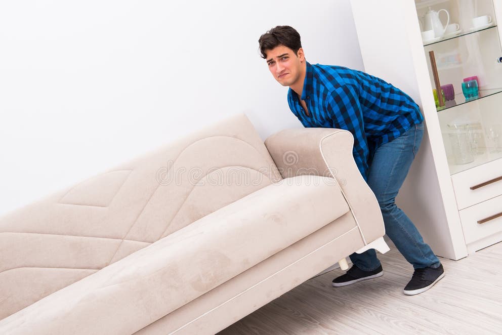 The Young Man Moving Sofa Couch Stock Image - Image of male, occupation ...