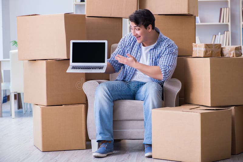 The Young Man Moving in To New House with Boxes Stock Photo - Image of ...