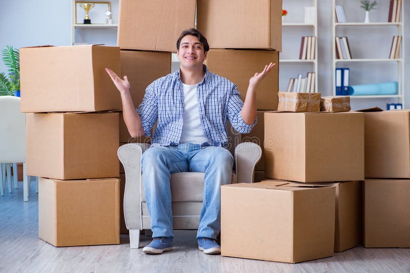 The Young Man Moving in To New House with Boxes Stock Image - Image of ...