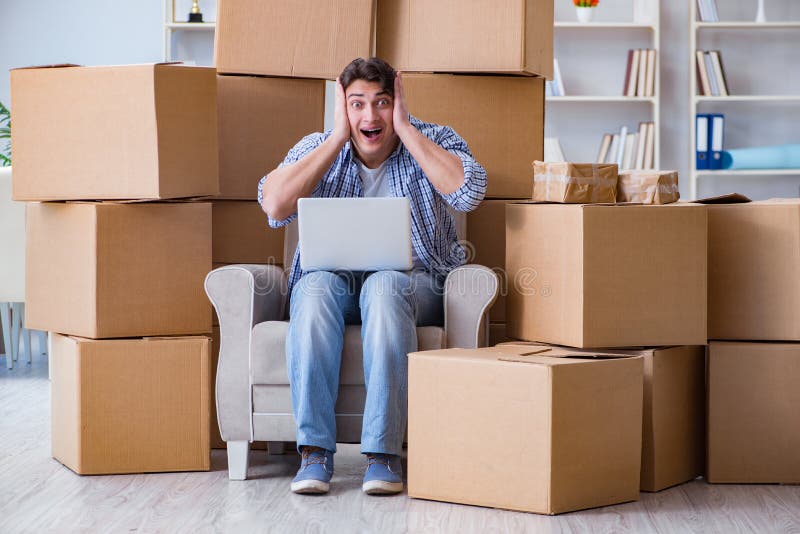 The Young Man Moving in To New House with Boxes Stock Image - Image of ...