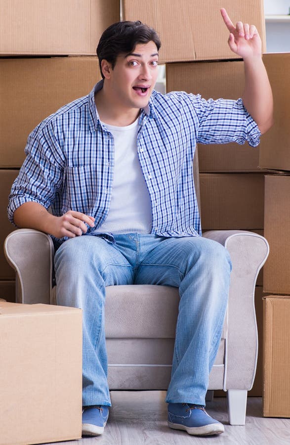 The Young Man Moving in To New House with Boxes Stock Photo - Image of ...