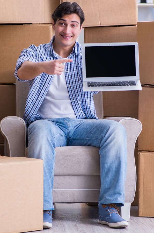 The Young Man Moving in To New House with Boxes Stock Image - Image of ...