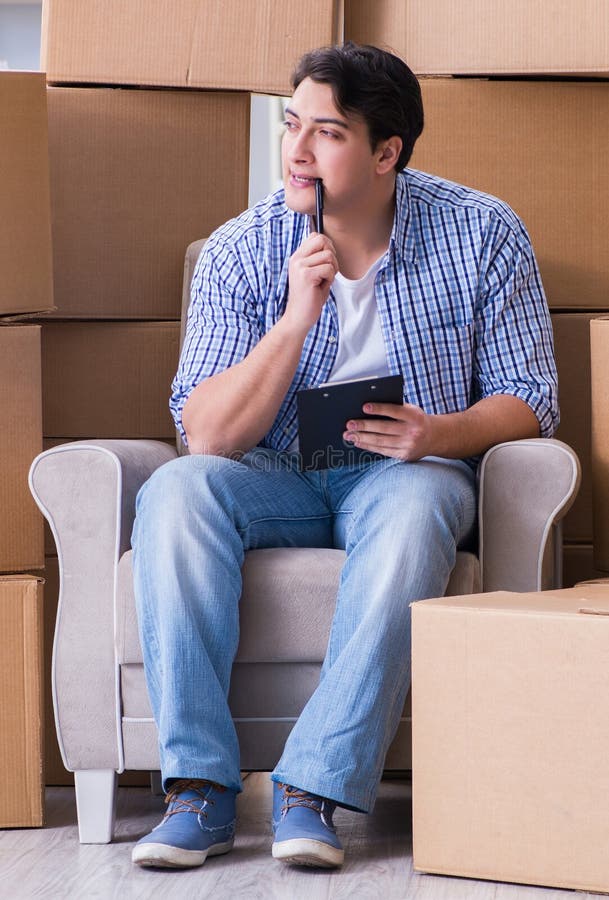 The Young Man Moving in To New House with Boxes Stock Photo - Image of ...