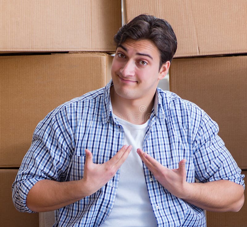 Young Man Moving in To New House with Boxes Stock Image - Image of ...
