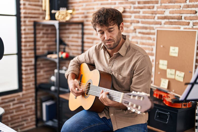 Young Man Musician Playing Classical Guitar at Music Studio Stock Image ...