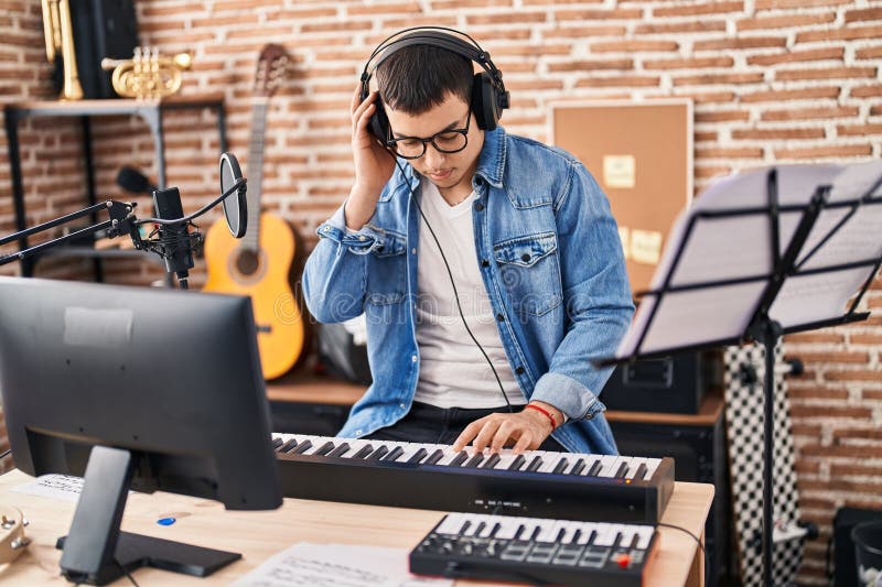 Young Man Musician Playing Piano Keyboard at Music Studio Stock Photo ...