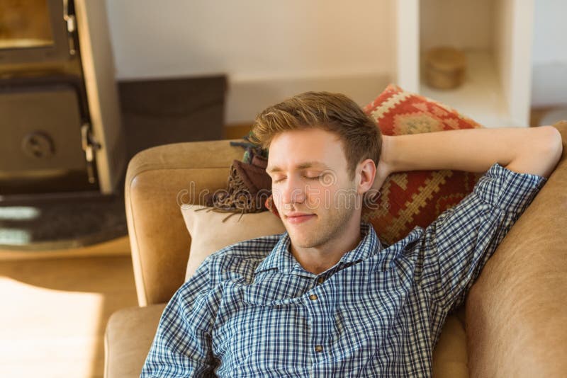 Young Man Napping on His Couch Stock Photo - Image of homey, peaceful ...