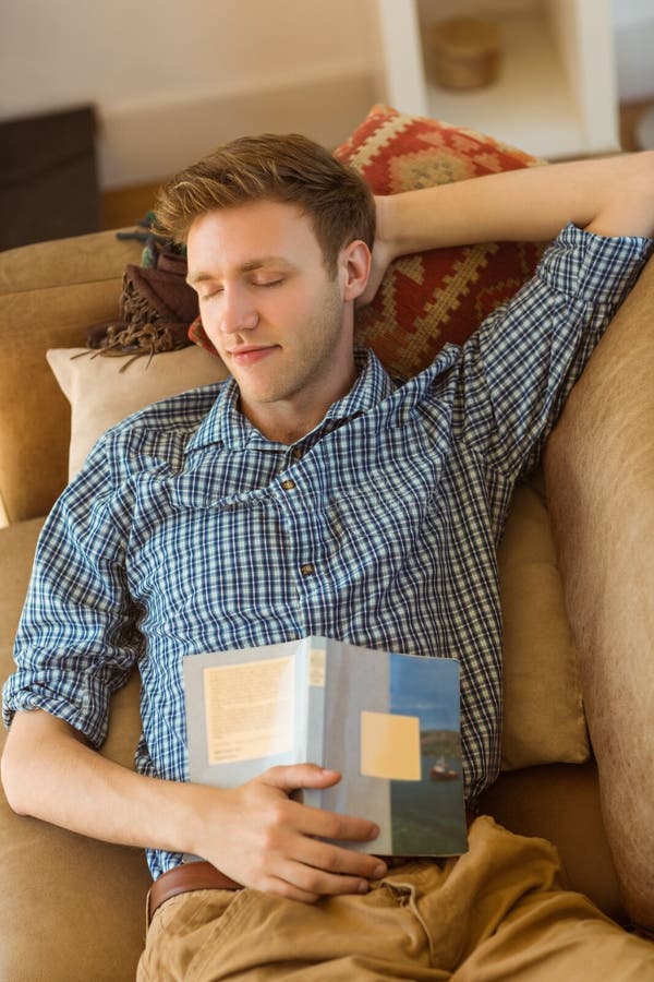 Young Man Napping on His Couch Stock Photo - Image of leisure, happy ...