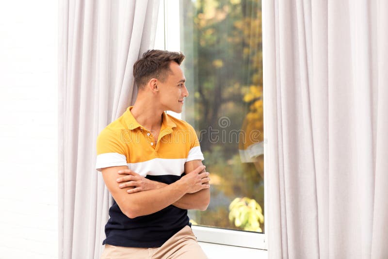 Young Man Near Window with Open Curtains Stock Image - Image of holiday ...