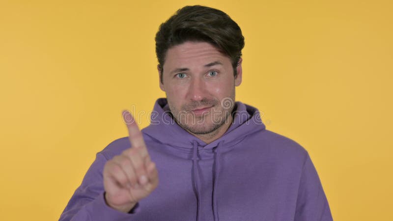 Young Man No Sign by Finger, Yellow Background Stock Footage - Video of ...