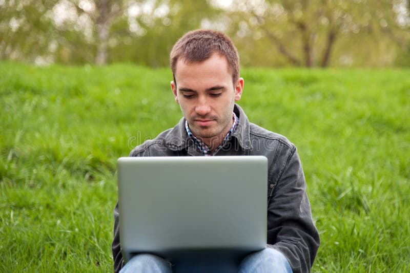 Young man with notebook stock image. Image of green, field - 28238725