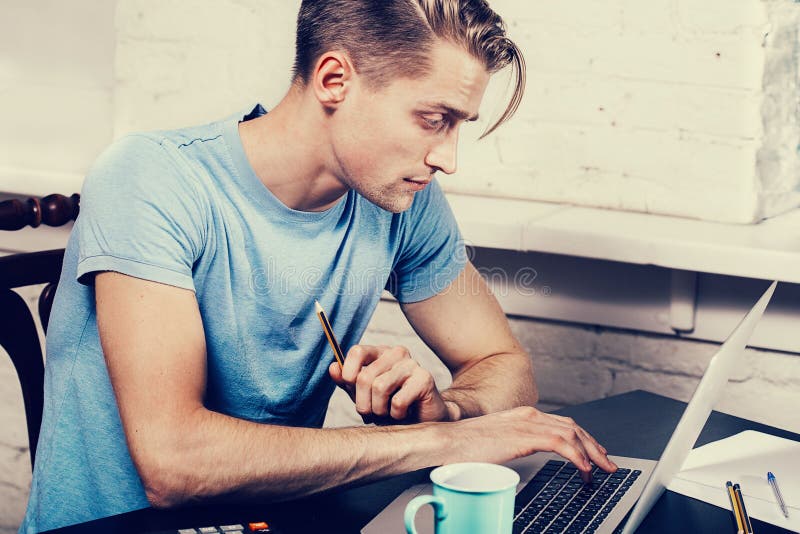 Young Man with Notebook Laptop Working on Work Place Stock Photo ...