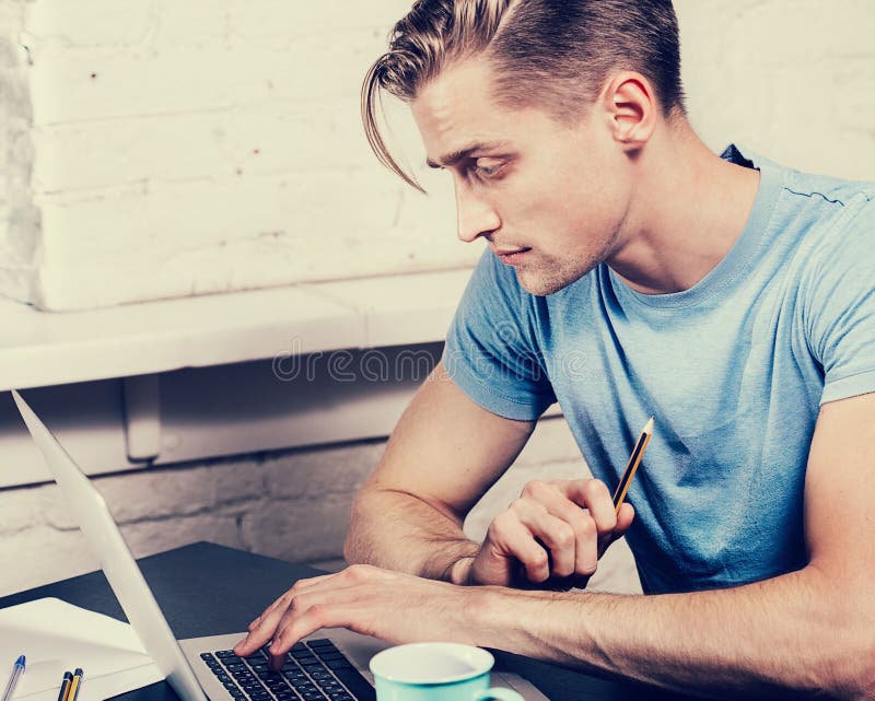 Young Man with Notebook Laptop Working on Work Place Stock Image ...