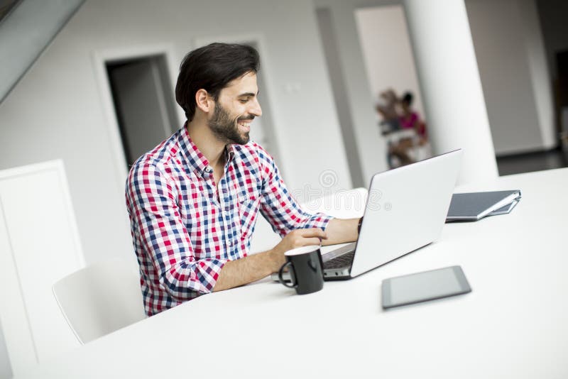 Young man at office stock image. Image of modern, looking - 64754503