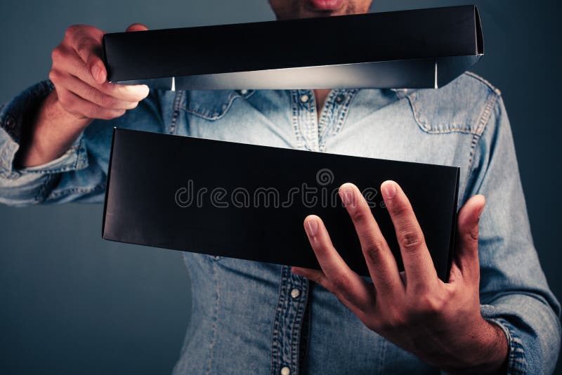 Young Man Opening an Exciting Box Stock Image - Image of gift, inside ...