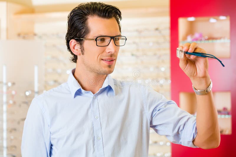 Young Man at Optician Shopping Sunglasses Stock Photo - Image of people ...