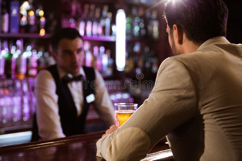 Young Man is Ordering Beer in Bar Stock Photo - Image of lager ...