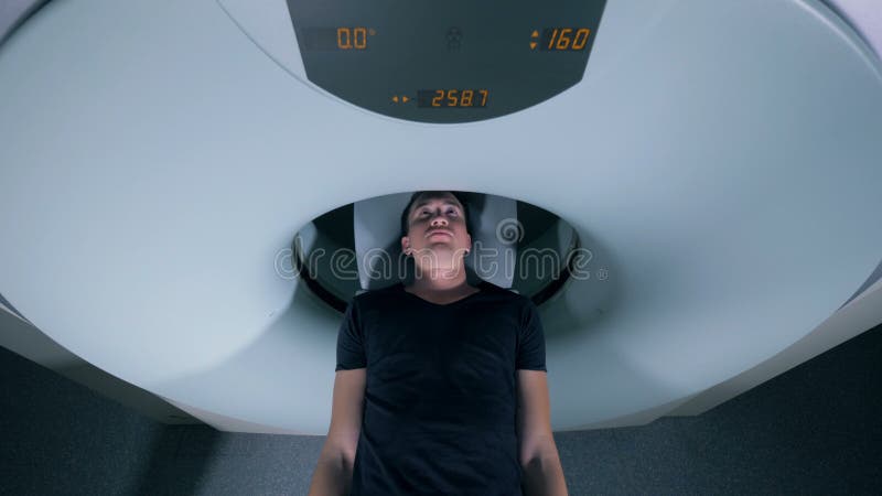 View from the Inside of an MRI Machine on a Male Patient Moving Out of ...