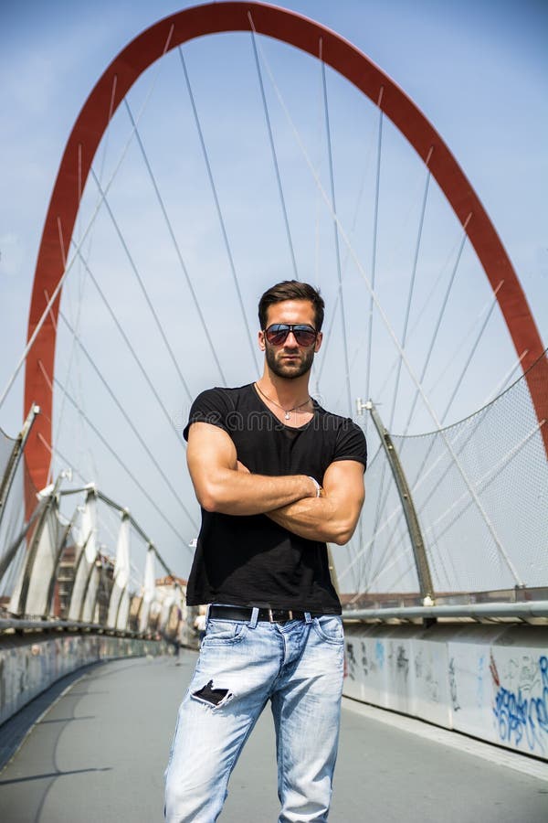 Young Man Outdoors in Front of Olympic Arch in Stock Image - Image of ...