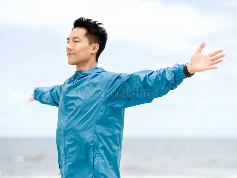 Young Man with Outstretched Arms at the Beach Stock Photo - Image of ...