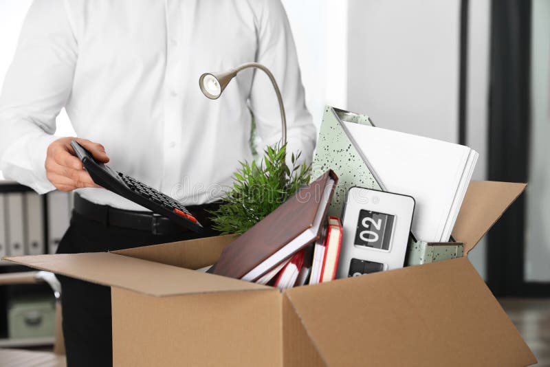Fired Male Employee Packing Box Of Belongings In An Office Stock Image ...