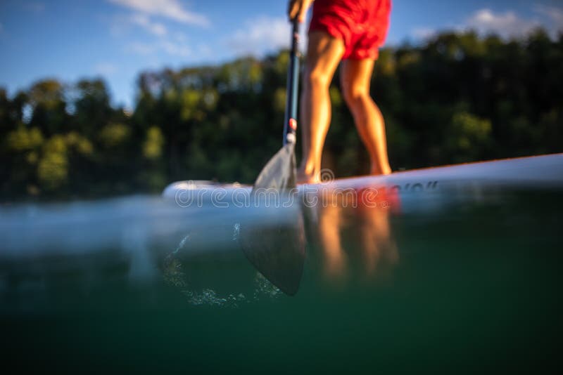 Young Man on a Paddle Board Stock Image - Image of healthy, male: 127209295