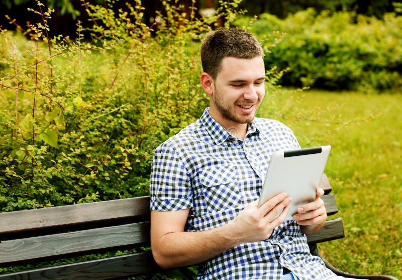 Young Man in Park stock image. Image of touch, lifestyle - 74426319