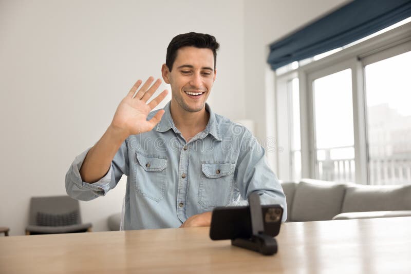 Young Man Participating in Virtual Meeting or Videocall Using ...