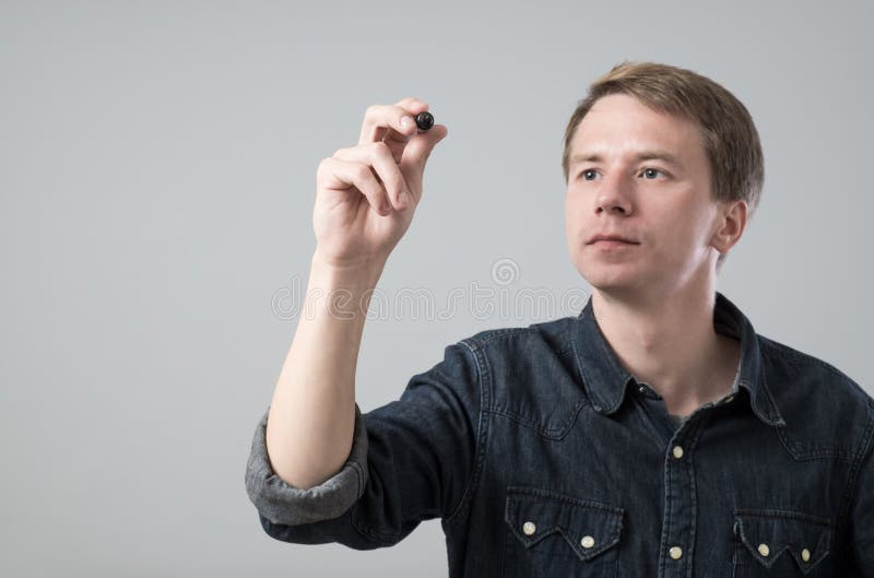 Young man with pen stock photo. Image of looking, empty - 100216716