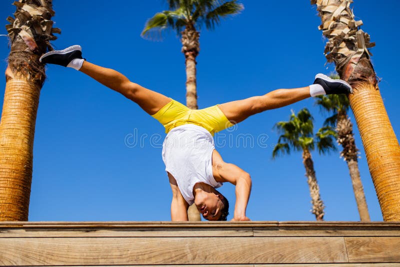 Young Man Man Performing Dance Movement Standing on Hand Outdoors in ...