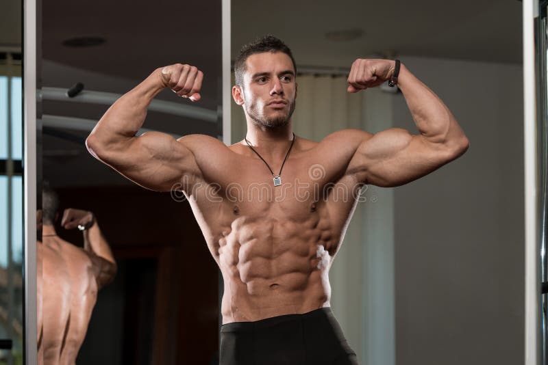 Young Man Performing Front Double Biceps Pose Stock Photo - Image of ...