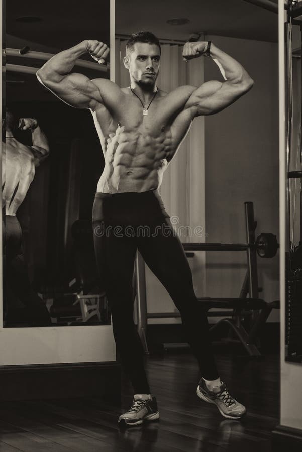Young Man Performing Front Double Biceps Pose Stock Photo - Image of ...