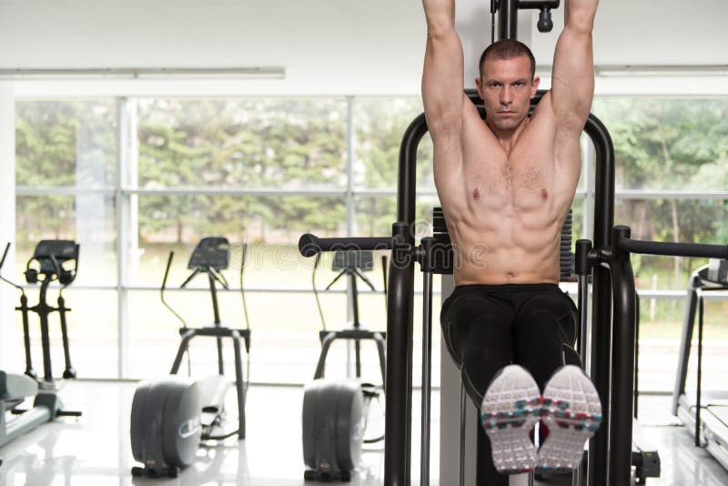 Young Man Performing Hanging Leg Raises Abs Exercise Stock Image ...
