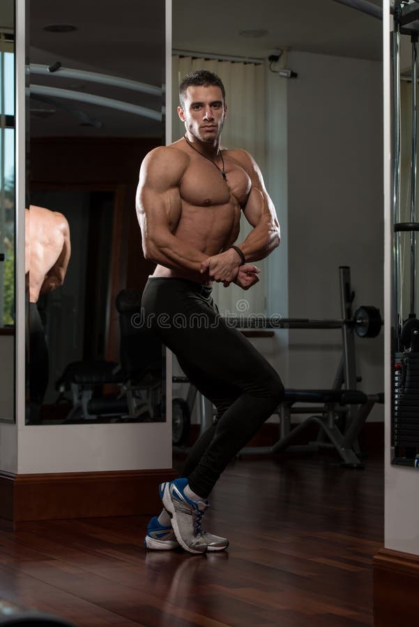 Young Man Performing Side Chest Pose Stock Photo - Image of chest ...