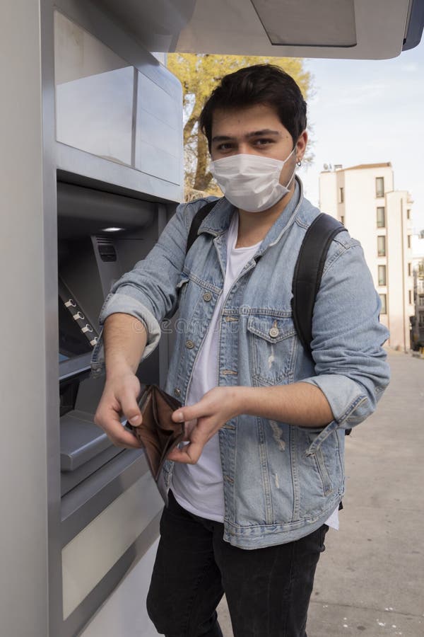 The Young Man Performs His Transactions from the Bank Atm Using His ...