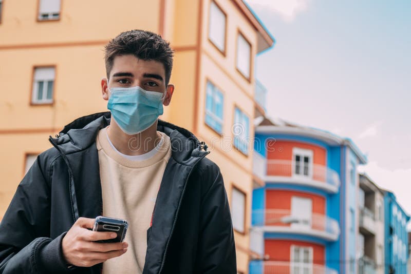Young Man with Phone and Mask Stock Image - Image of protection, mobile ...