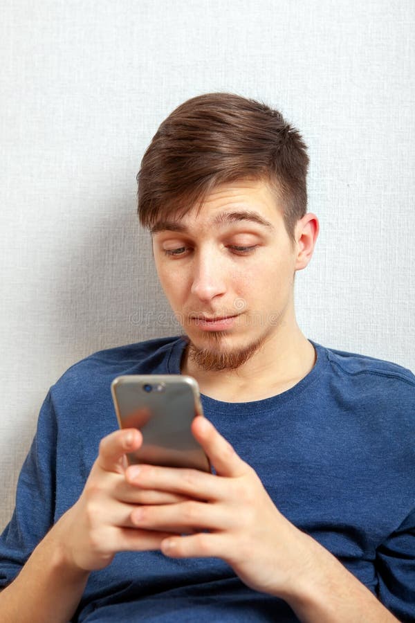 Young Man with a Phone stock photo. Image of caucasian - 191077528