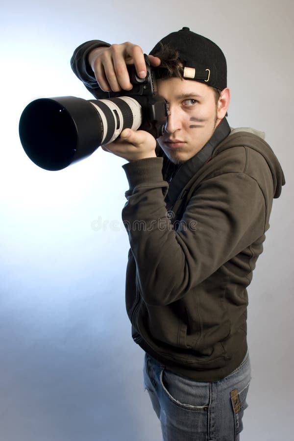 Young Man with a Photo Camera Stock Image - Image of professional, lens ...