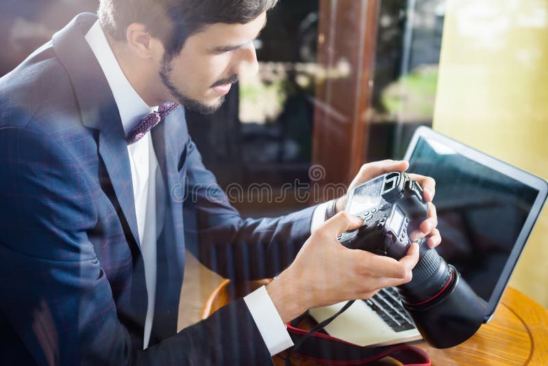 Young Man Photographer Working at Cafe, Using Dslr Camera Stock Image ...