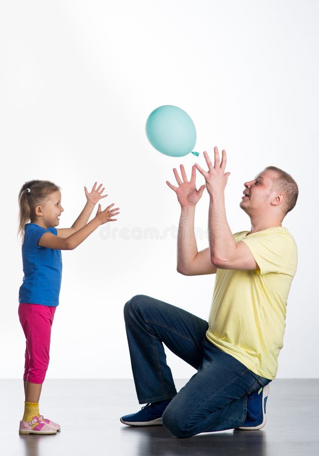 Young Man Playing with Baby Stock Image - Image of happy, daughter ...