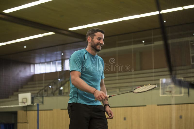 Young Man Playing Badminton Stock Image - Image of hand, friend: 92989481