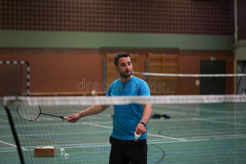 Young Man Playing Badminton Stock Image - Image of hand, friend: 92989481