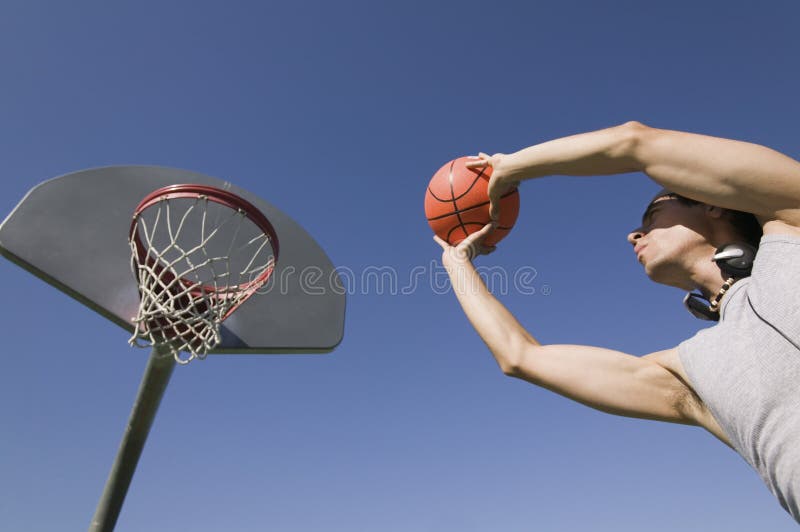 Young Man Playing Basketball Low Angle View. Stock Photo - Image of ...