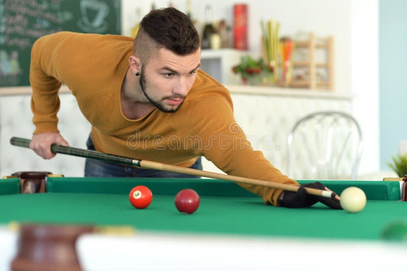Young man playing billiard stock photo. Image of people - 85329260