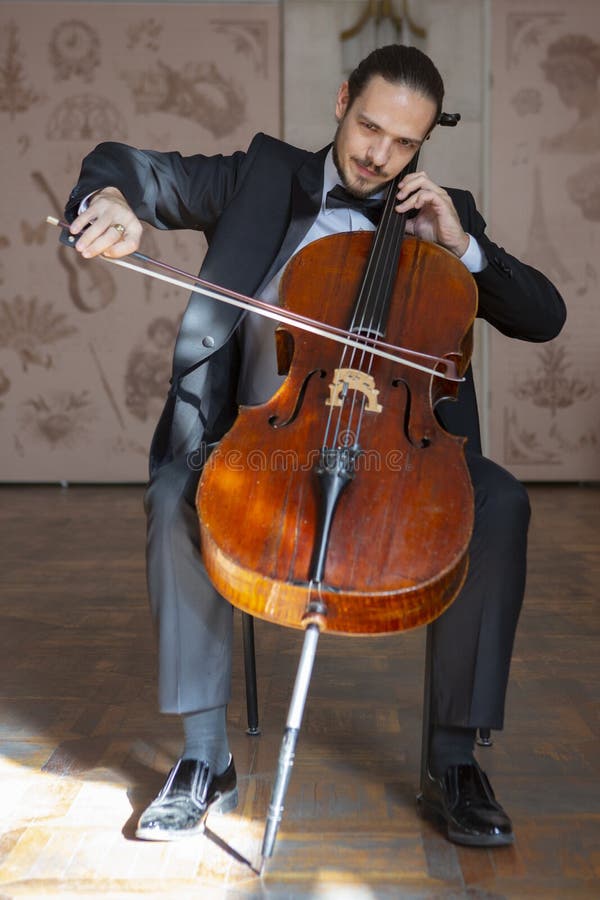 Young Man Playing the Cello. Portrait of the Cellist Stock Photo ...