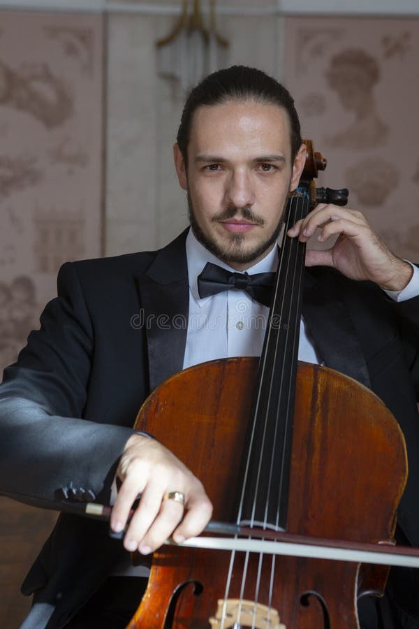 Young Man Playing the Cello. Portrait of the Cellist Stock Photo ...